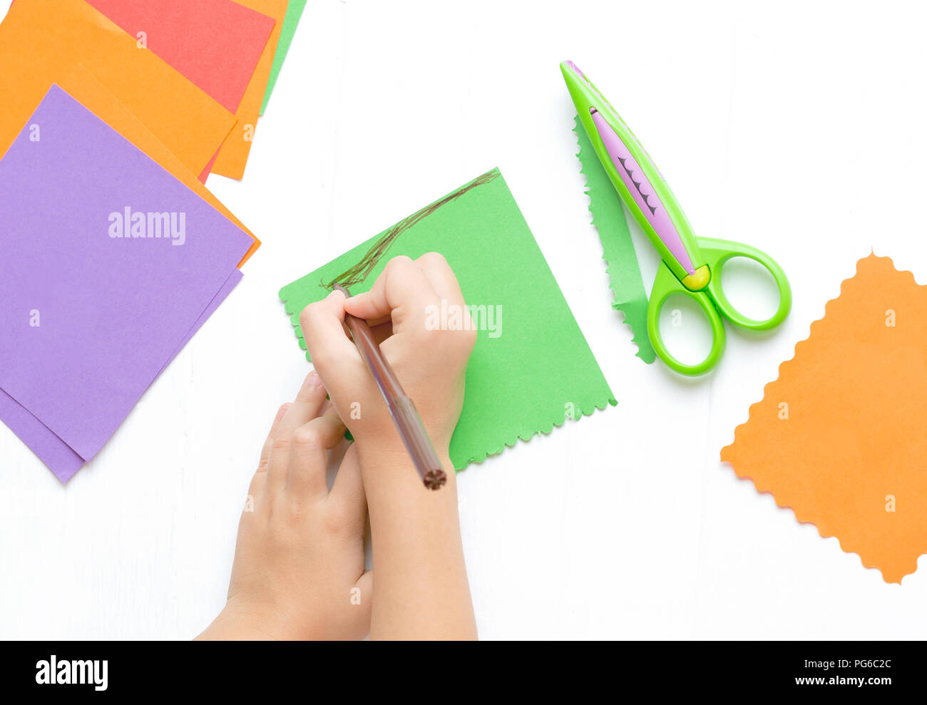 Child cutting out scissors paper hi-res stock photography and images ...