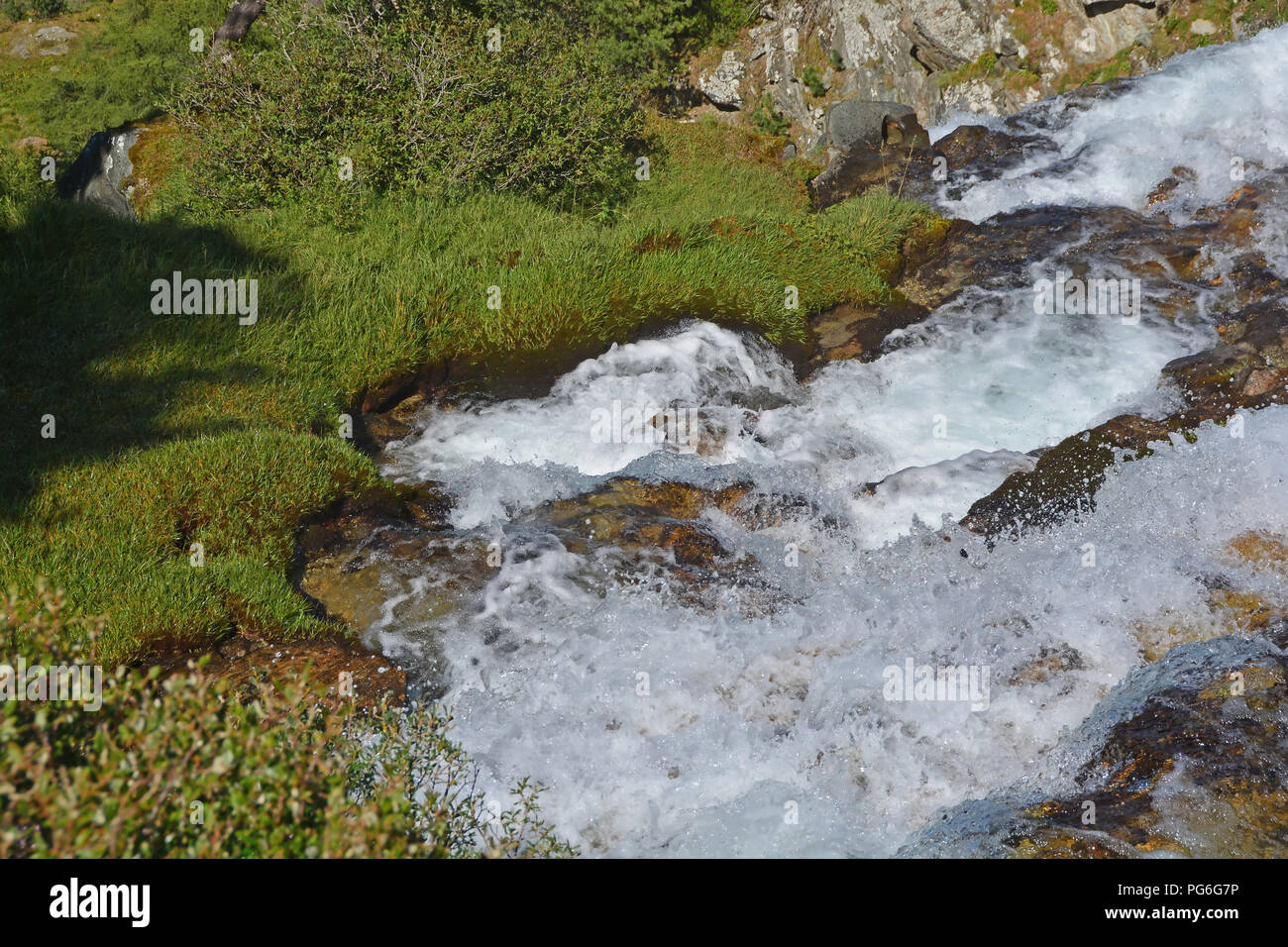 High waterfall in the mountains Stock Photo - Alamy