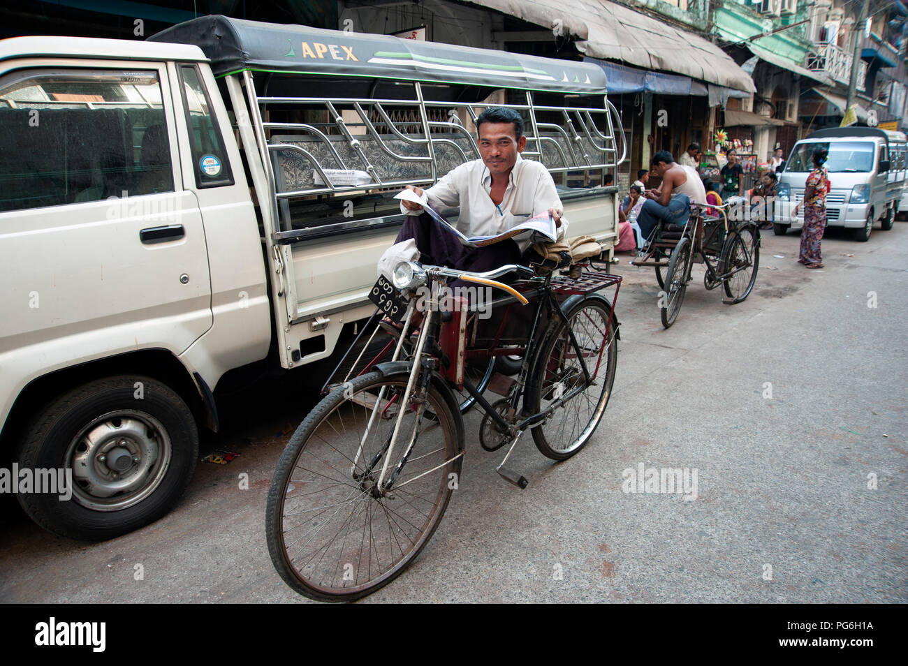 Happy yangon three wheeled rickshaw taxi driver hi-res stock ...