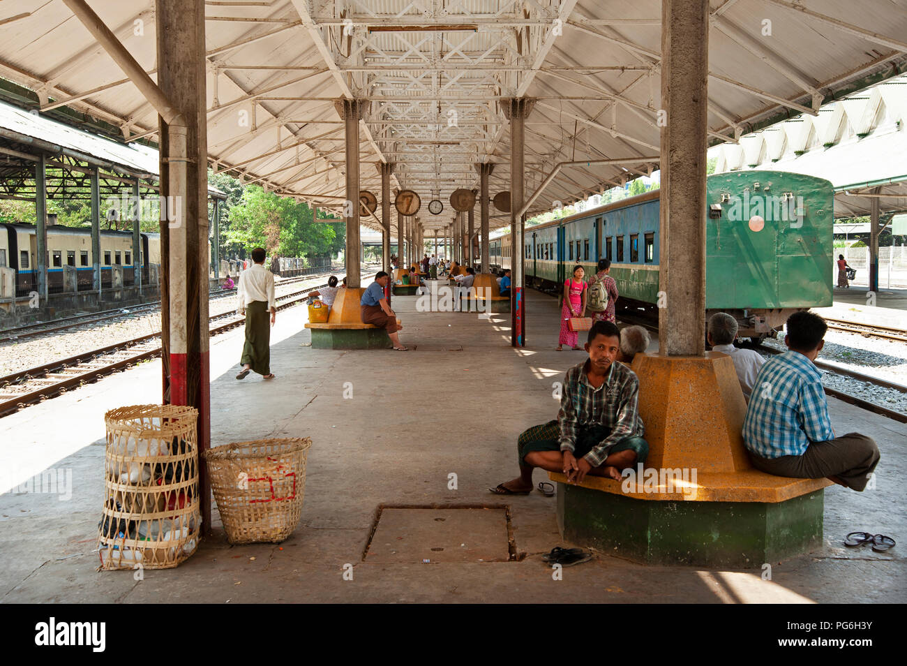 Burmese people waiting on a railway platform in Yangon station Myanmar ...