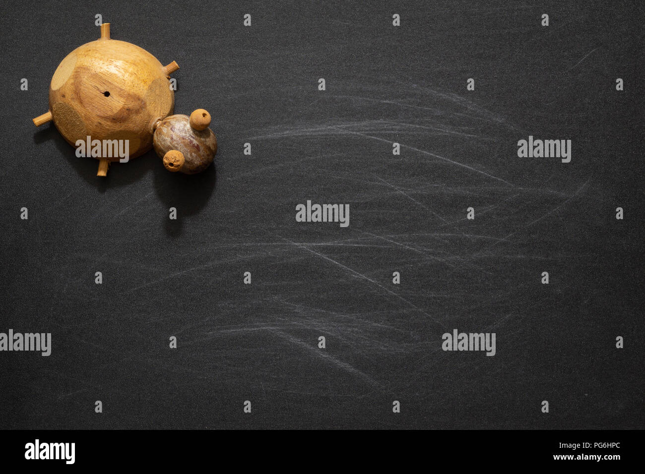 Cute turtle toys on black chalkboard with blank copy space, ideal for ...