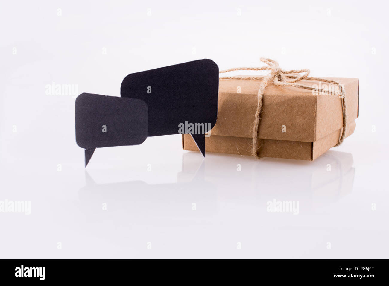 Dialogue boxes near a carton box on a white background Stock Photo - Alamy