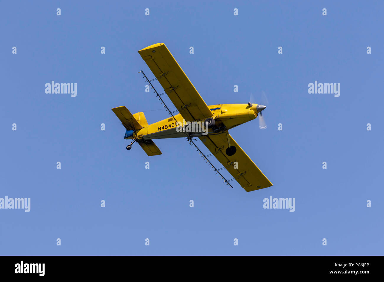 Crop duster plane flying and spraying over crops in the Palouse region ...