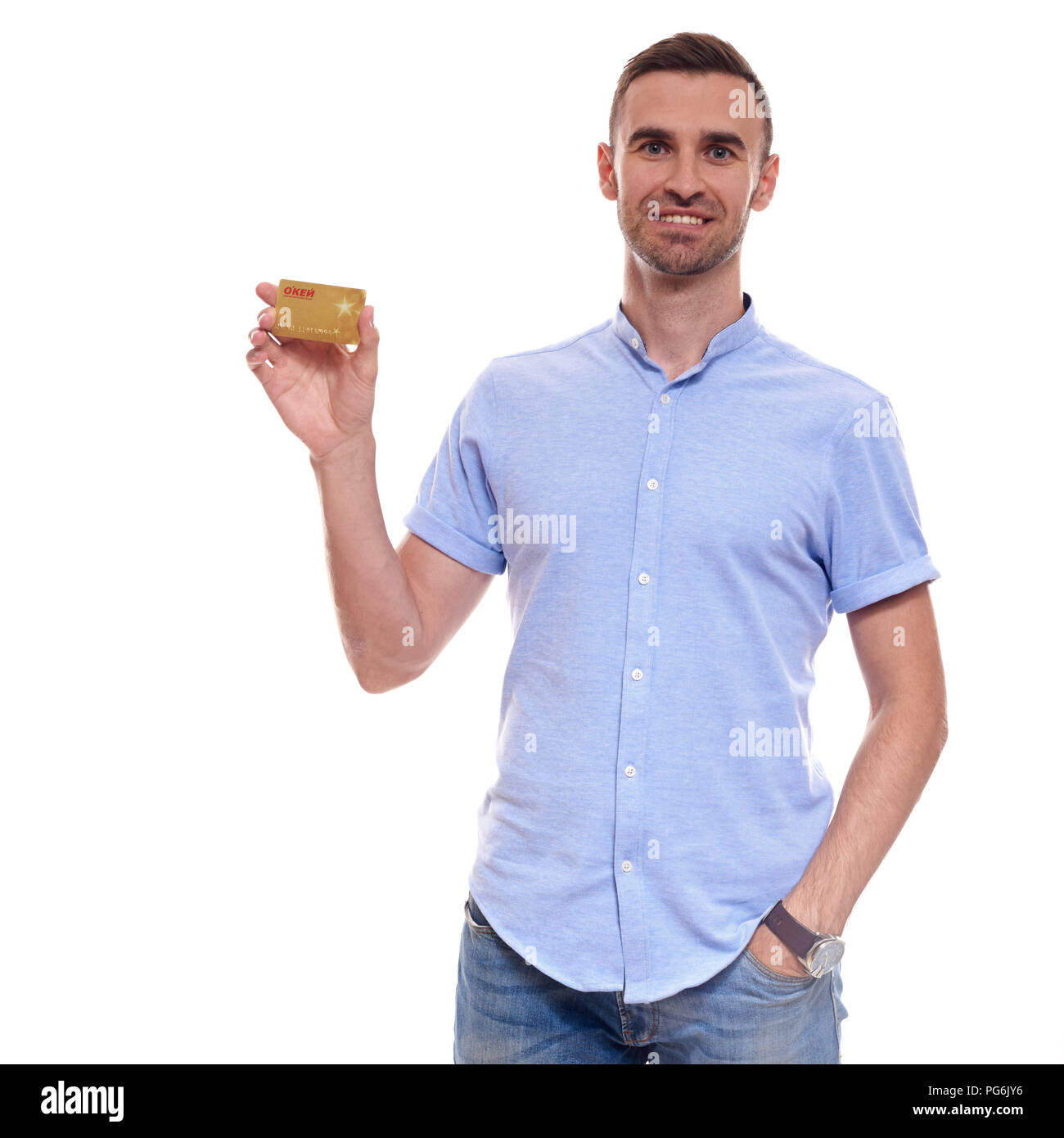 Happy smiling young man showing credit card isolated on white ...