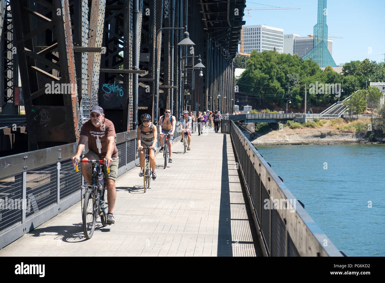 Cyclists crossing the Steel Bridge over the Willamette River, Portland ...