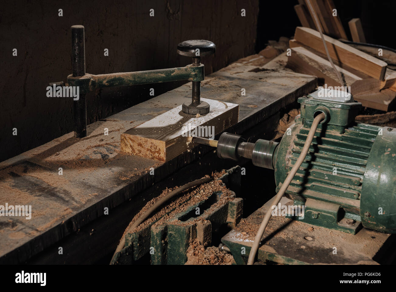 close up view of woodworkers workplace with equipment and wood at ...