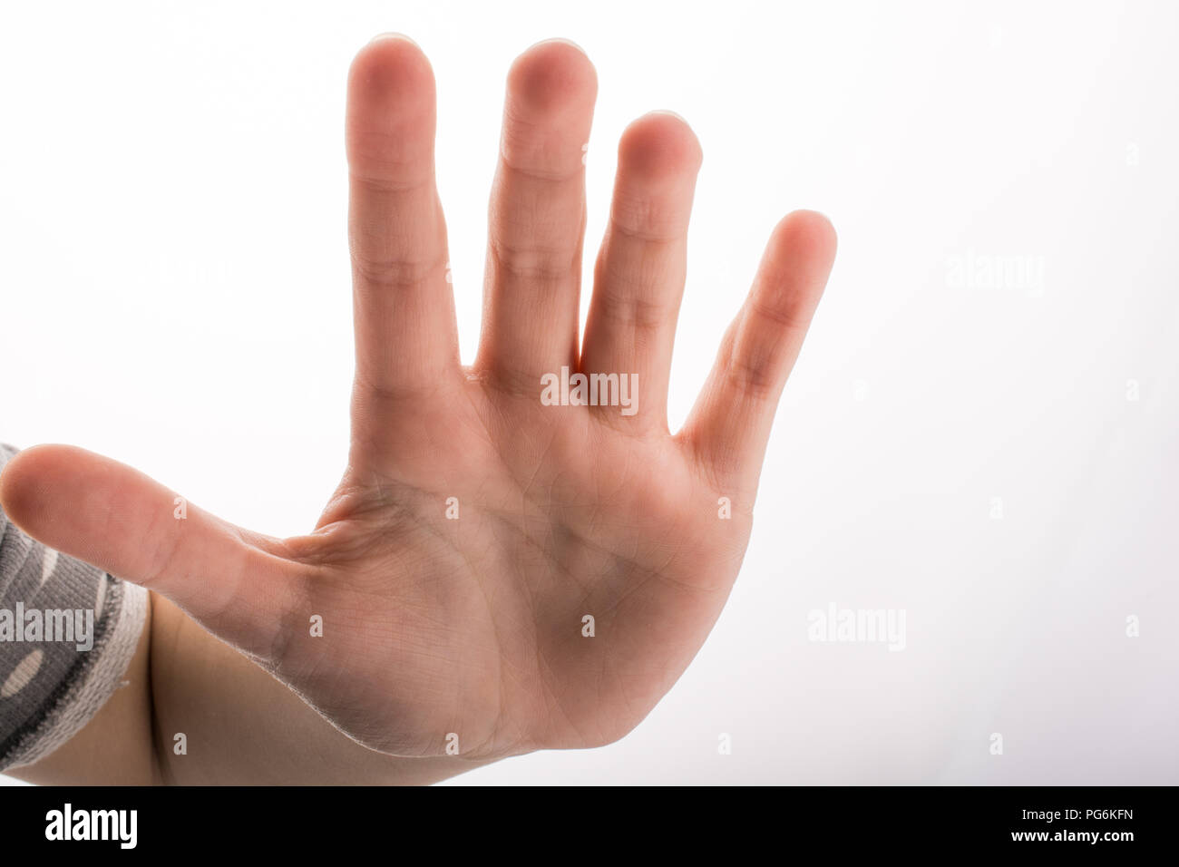 Hand making a stop gesture Stock Photo - Alamy