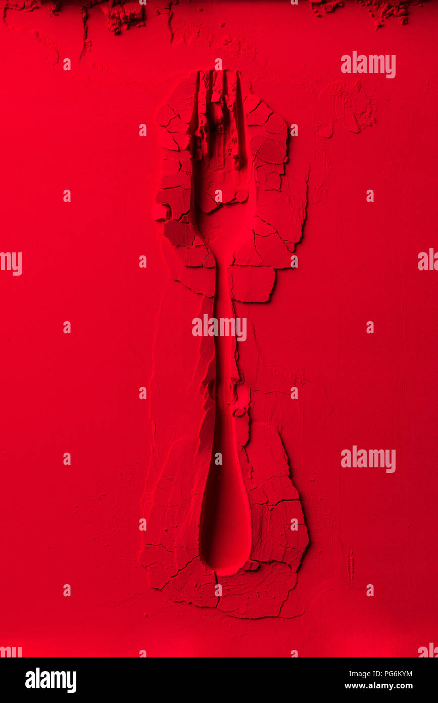 top view of shape of fork on red powder Stock Photo - Alamy