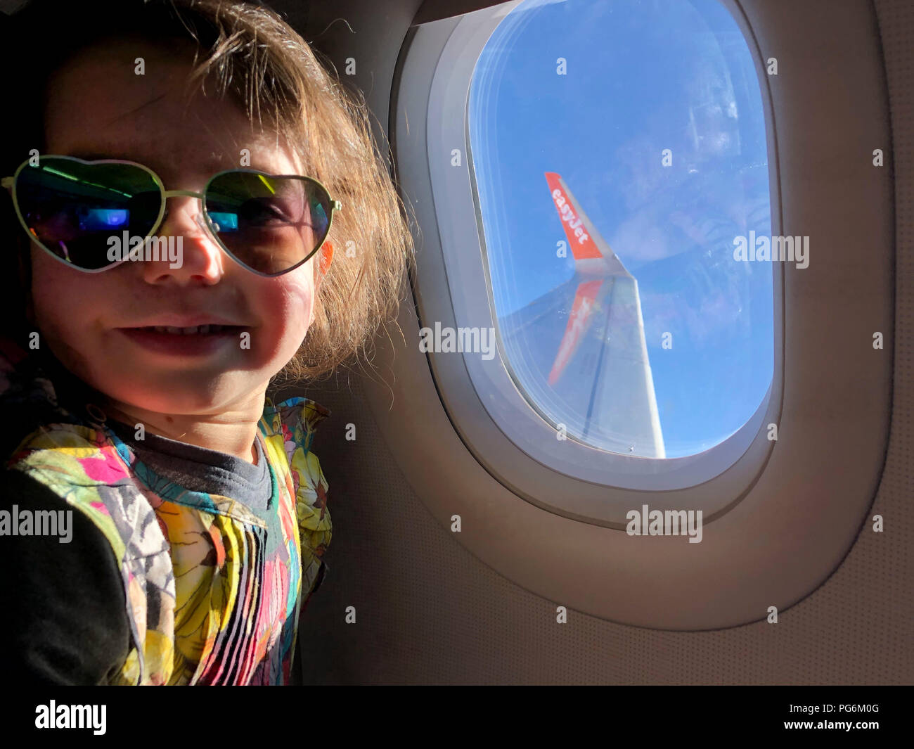 Young girls on an Easy Jet flight Stock Photo - Alamy