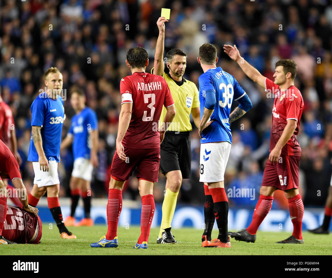 Rangers Kyle Lafferty is shown a yellow card by referee Daniel ...
