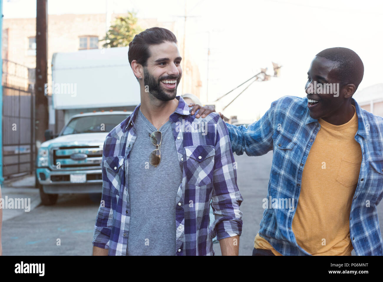 Happy young men hi-res stock photography and images - Alamy