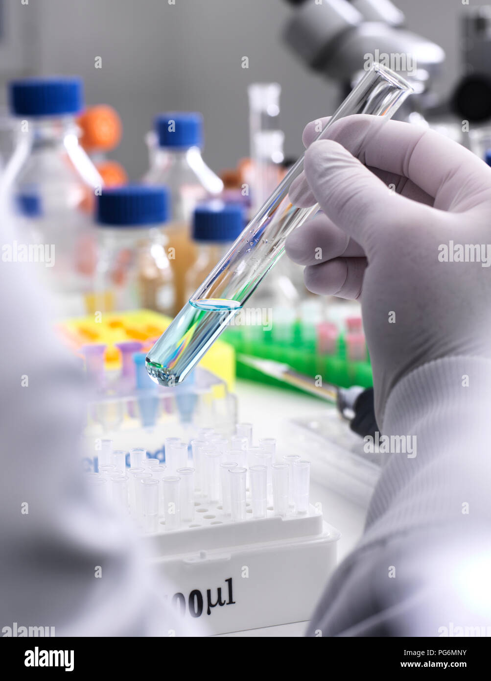 Research experiment, Scientist mixing a chemical formula in a test tube ...