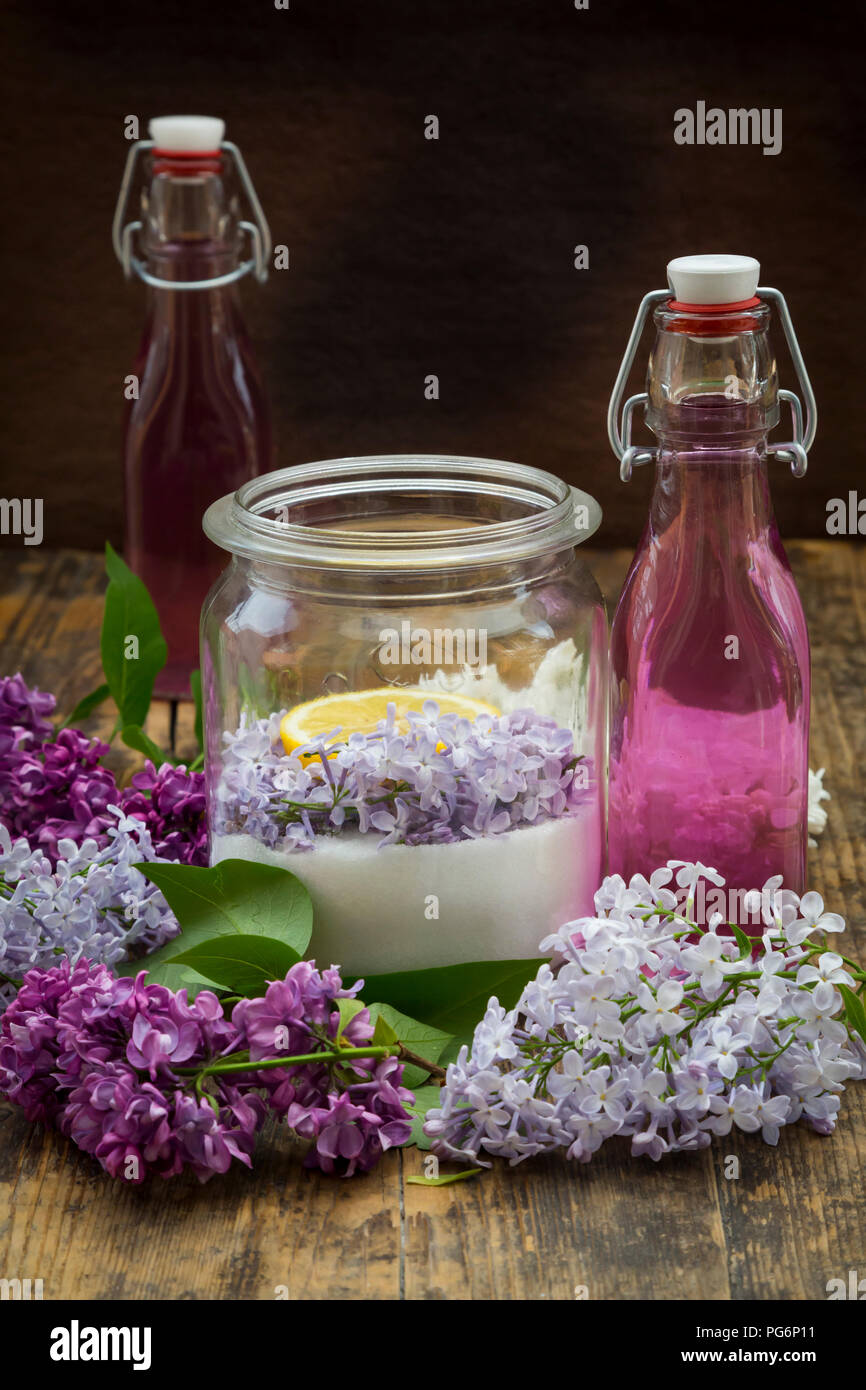 Glass bottles of homemade lilac sirup and ingredients in glass Stock ...
