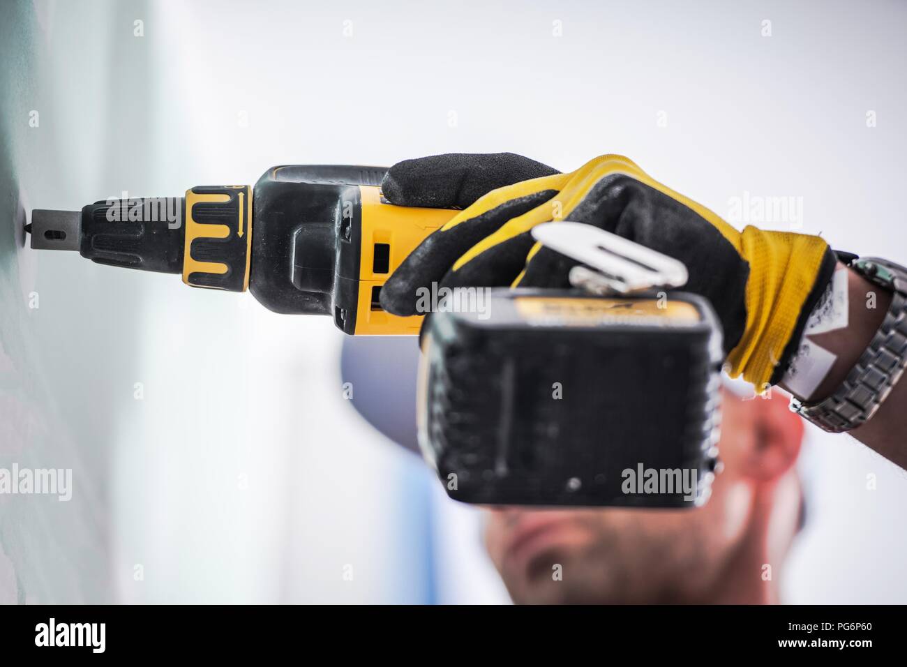 Drywall Installation Project. Caucasian Construction Worker with Drill ...