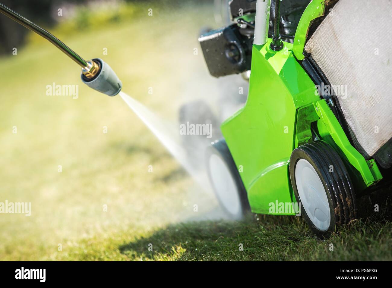 Mowing Machine Cleaning by Pressure Washer Stock Photo - Alamy