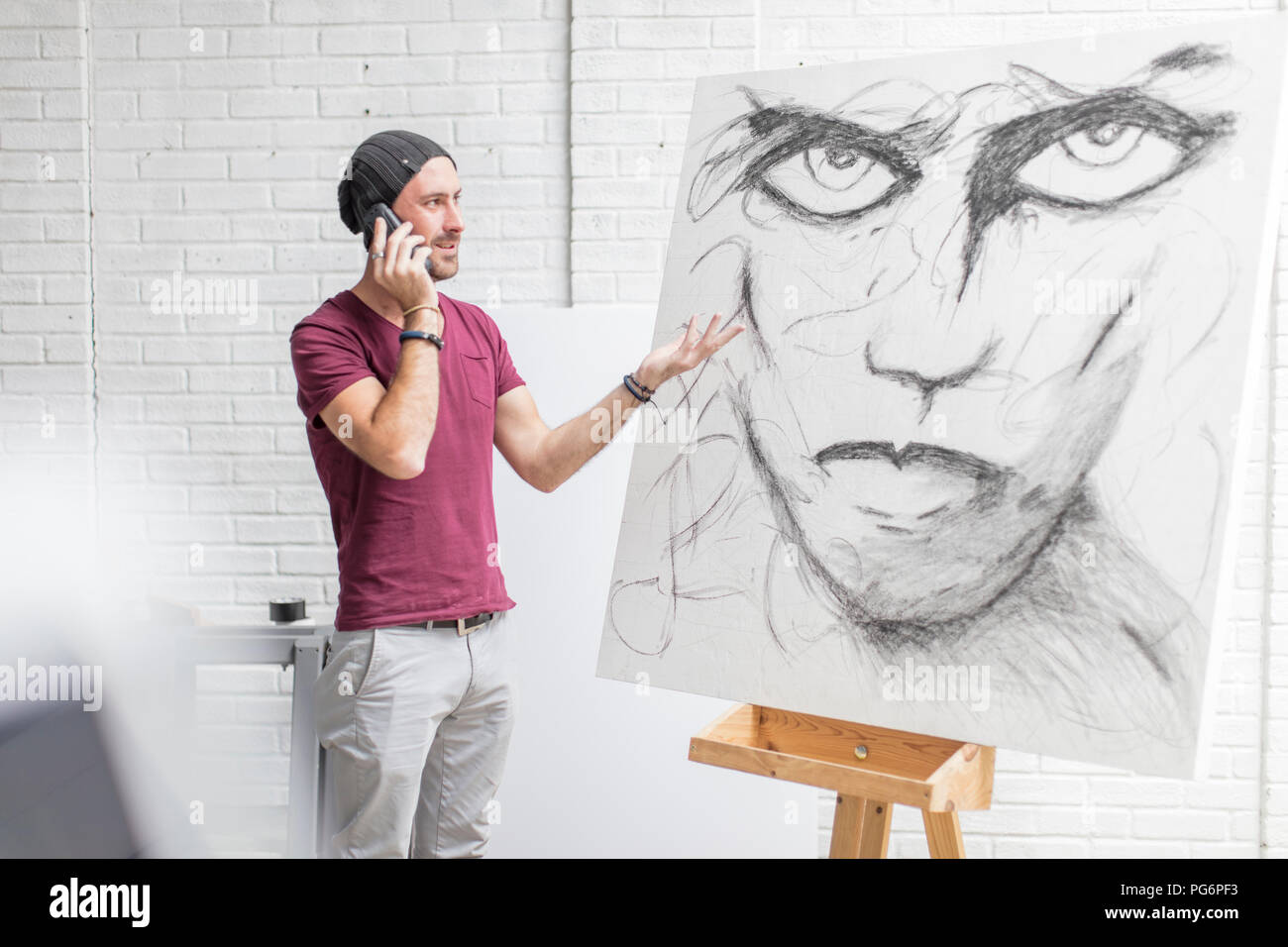 Male artist painting using hi-res stock photography and images - Alamy
