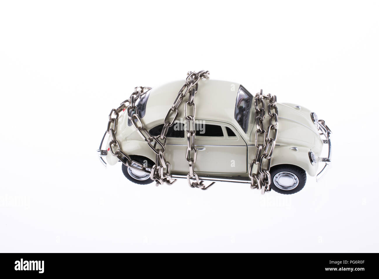 Chained white car on white background Stock Photo - Alamy