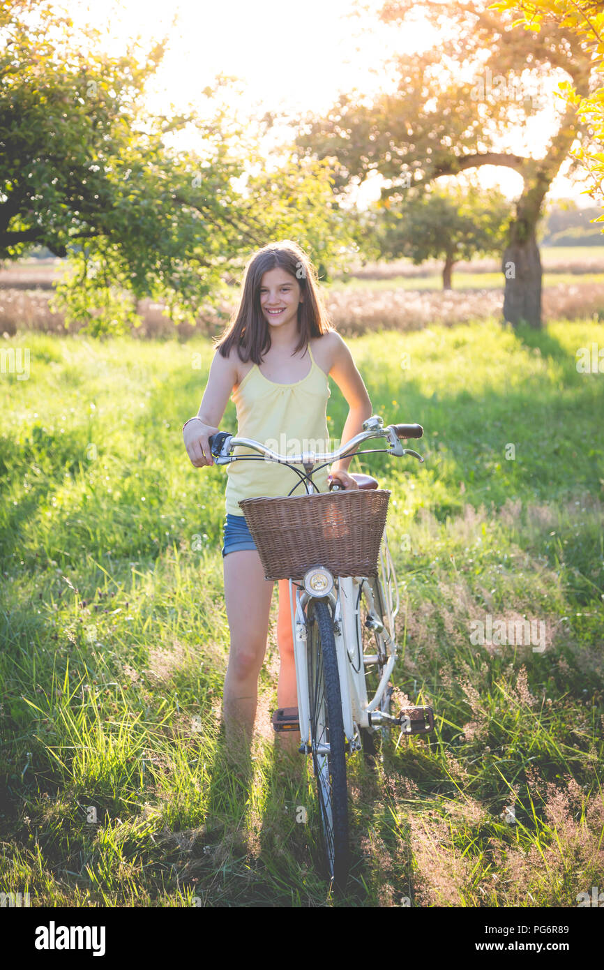 Back view girl riding bicycle hi-res stock photography and images - Alamy