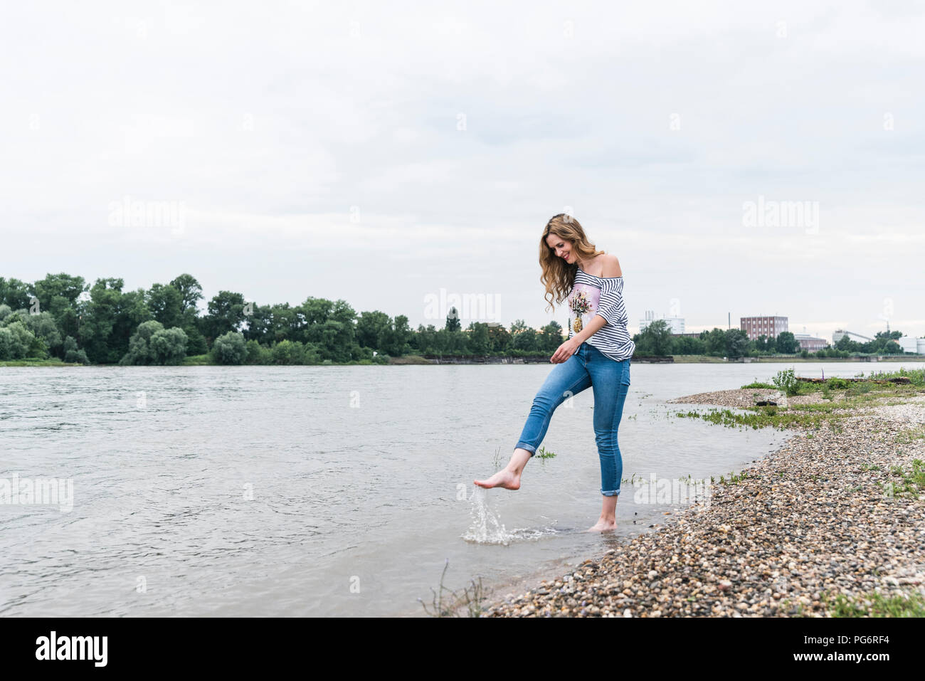 Woman splashing in river hi-res stock photography and images - Alamy