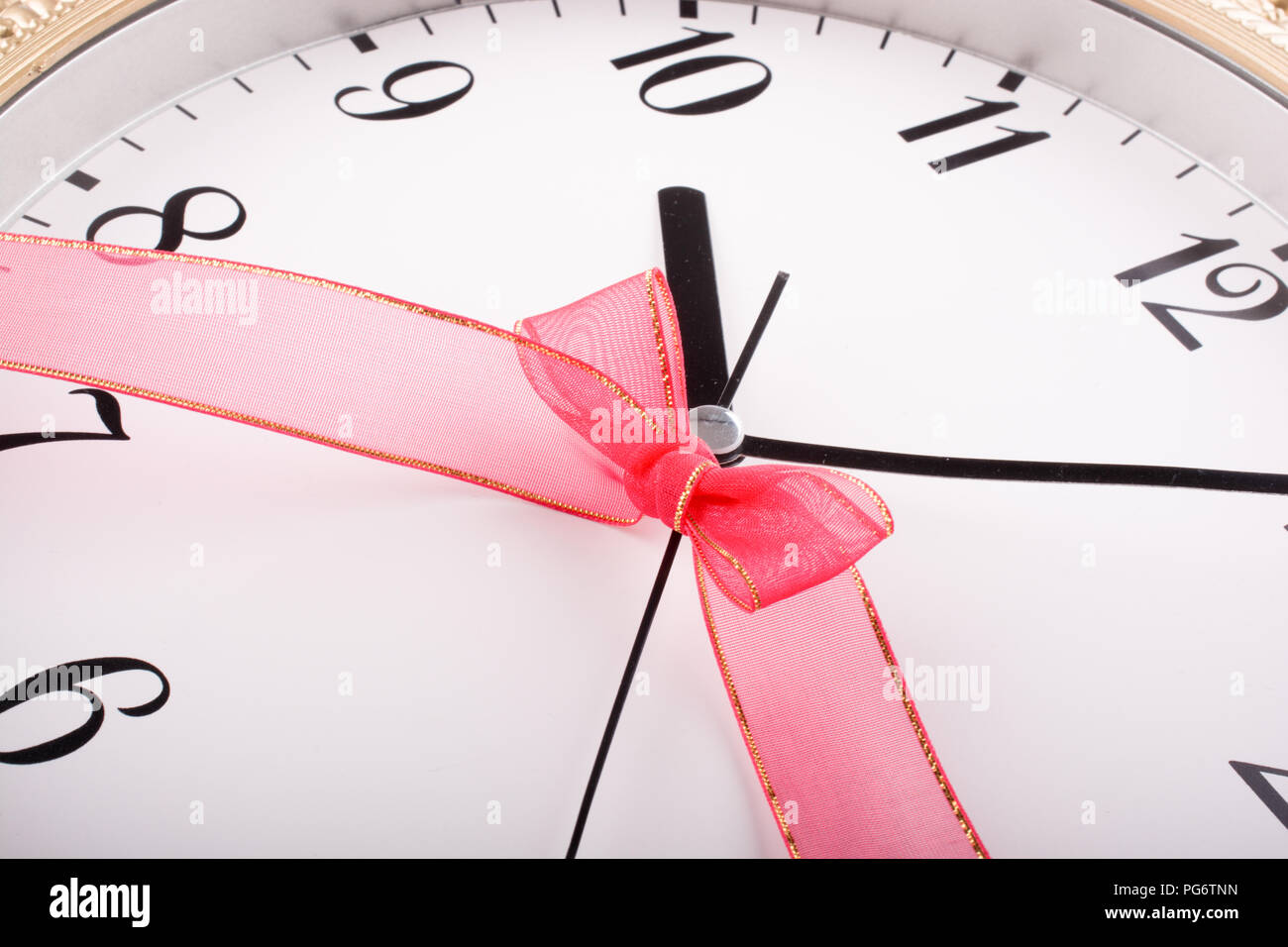 clock with ribbon in it Stock Photo - Alamy
