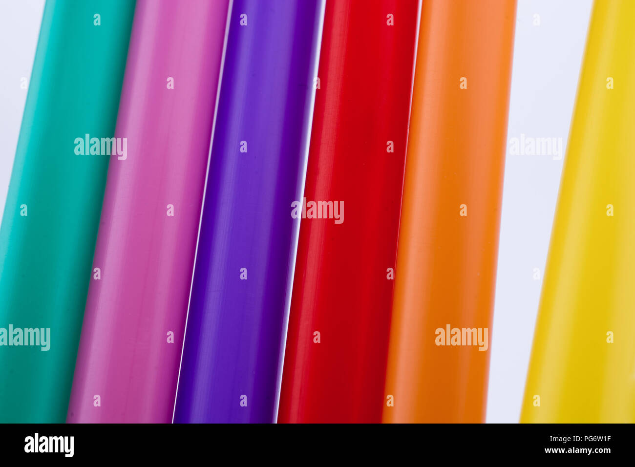 different color of straw on a white background Stock Photo - Alamy