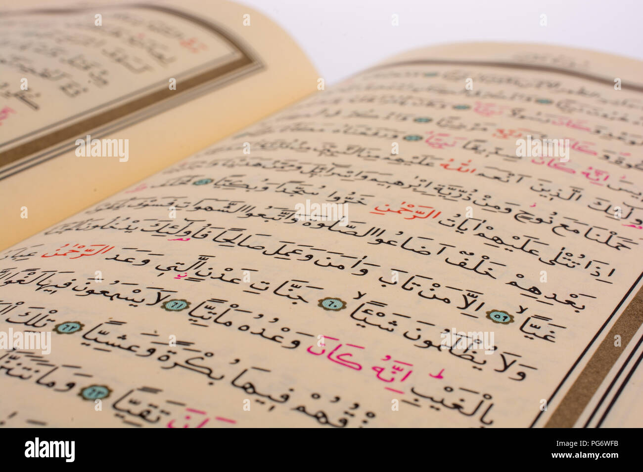The Holy Quran on a white background Stock Photo - Alamy