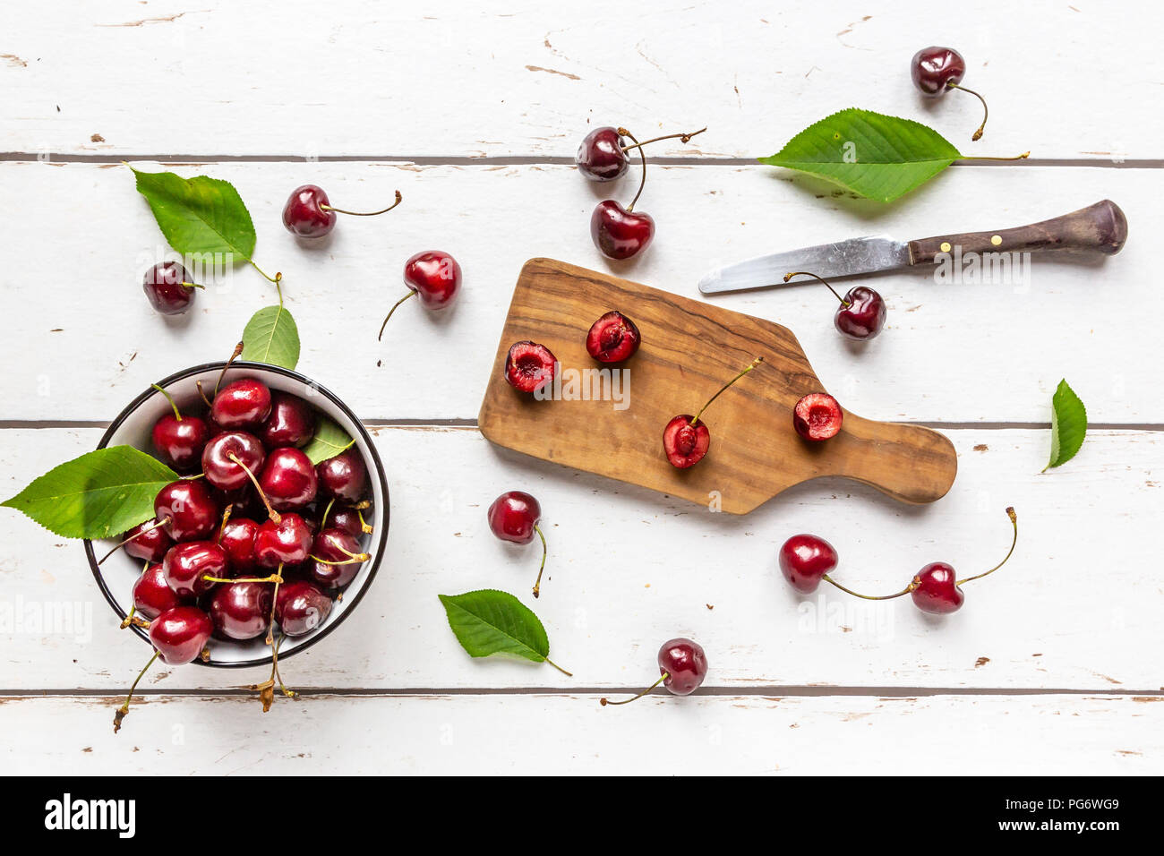 Sliced and whole cherries Stock Photo - Alamy