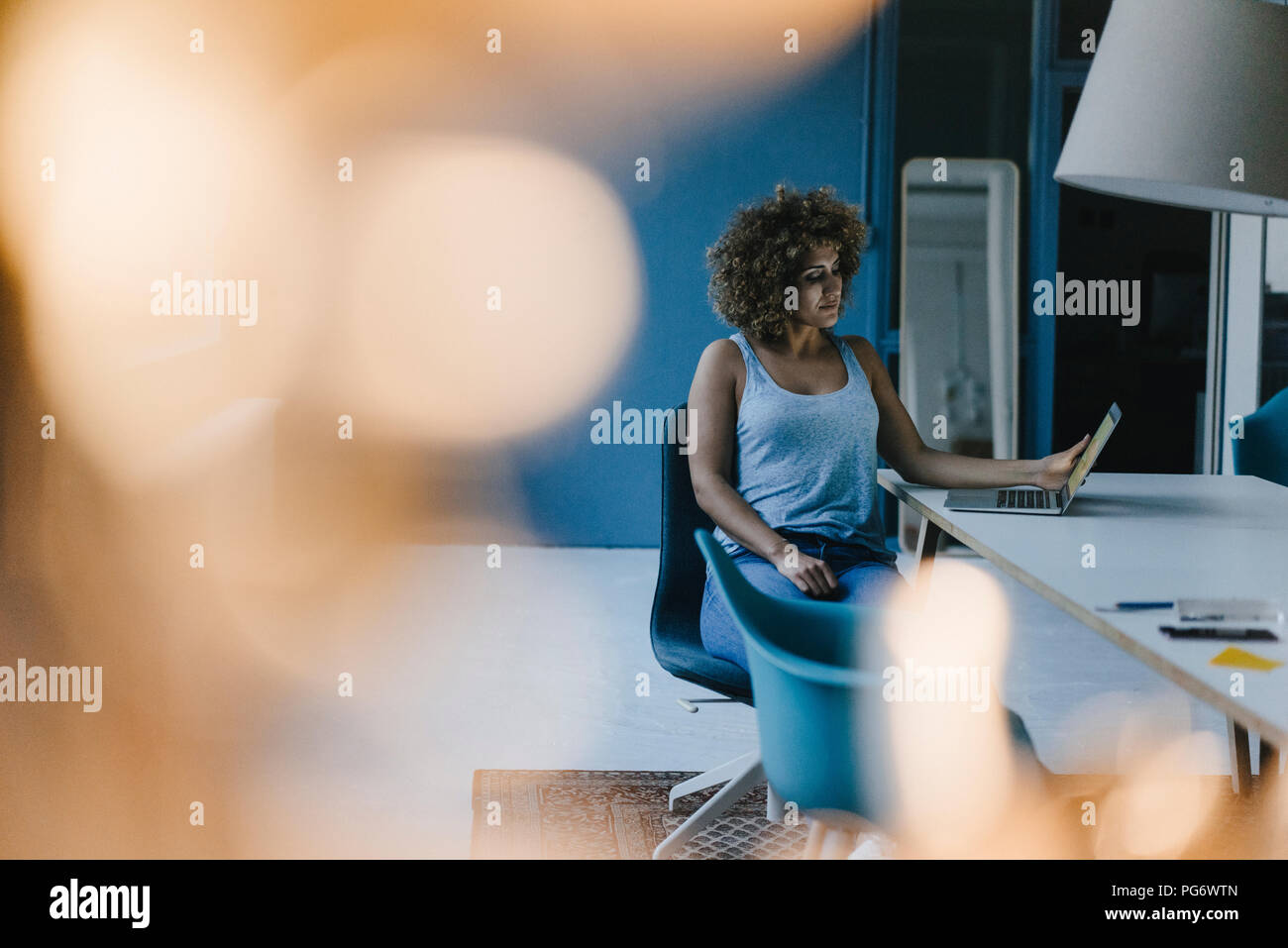 Woman working overtime in her start up business hi-res stock ...