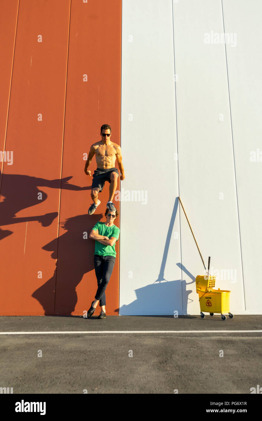 Acrobat standing arms crossed hi-res stock photography and images - Alamy
