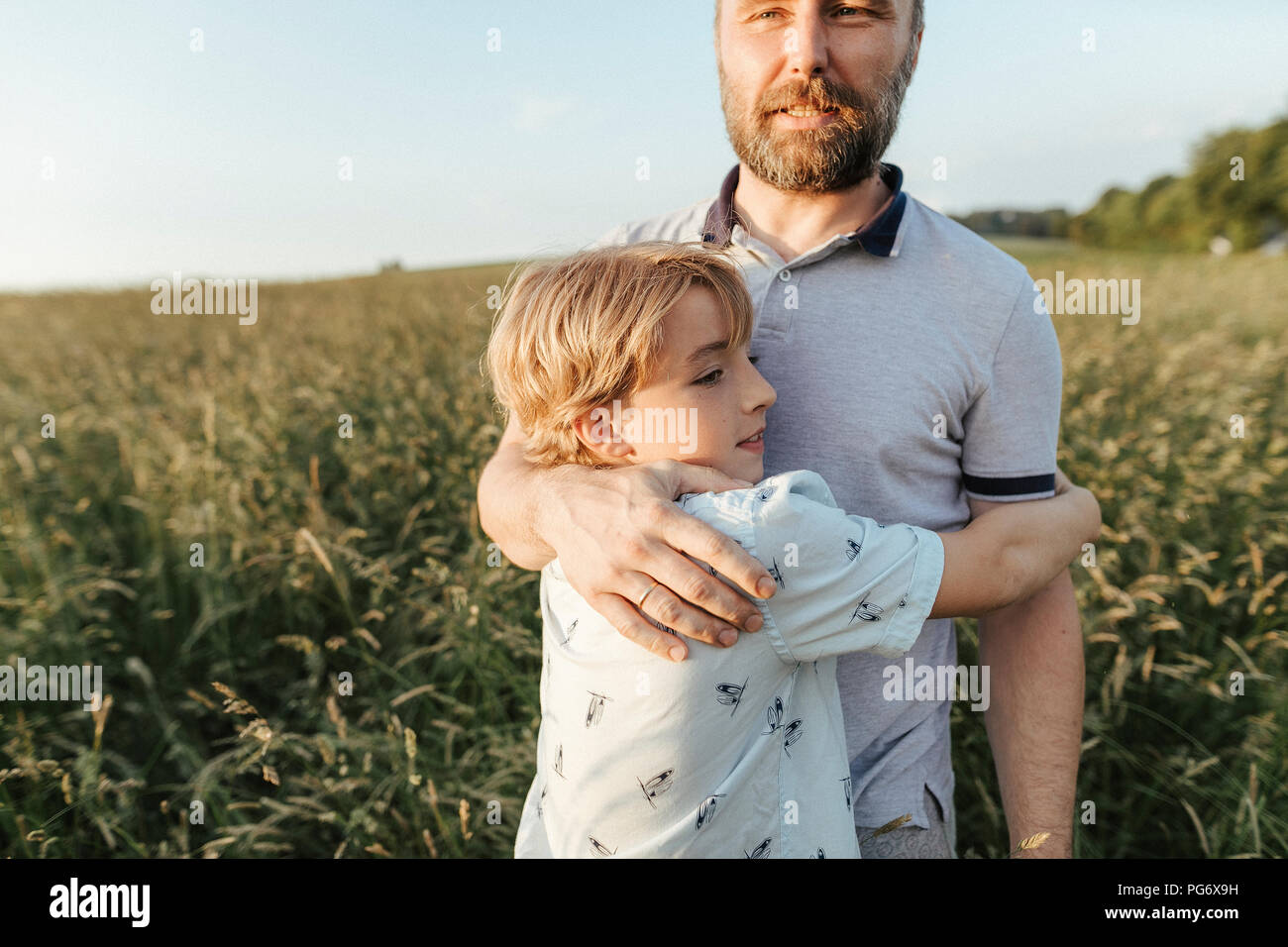 Son hugging father hi-res stock photography and images - Alamy