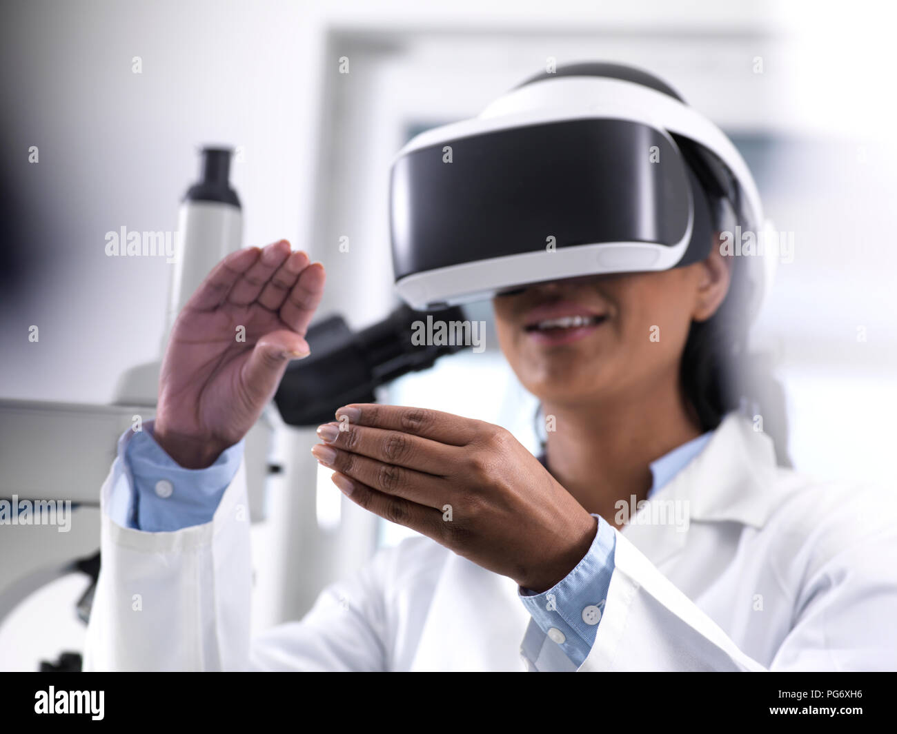 Female scientist using virtual reality to understand a research ...