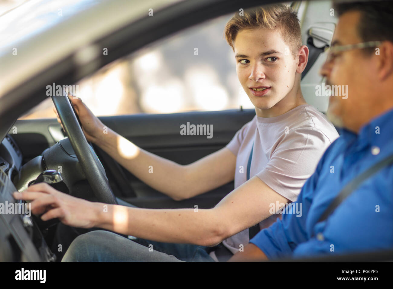 Learner driver with instructor in car Stock Photo - Alamy