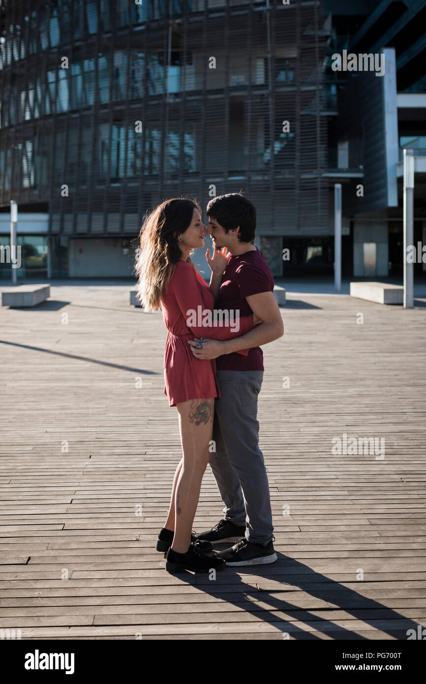 Happy affectionate young couple standing city square hi-res stock ...