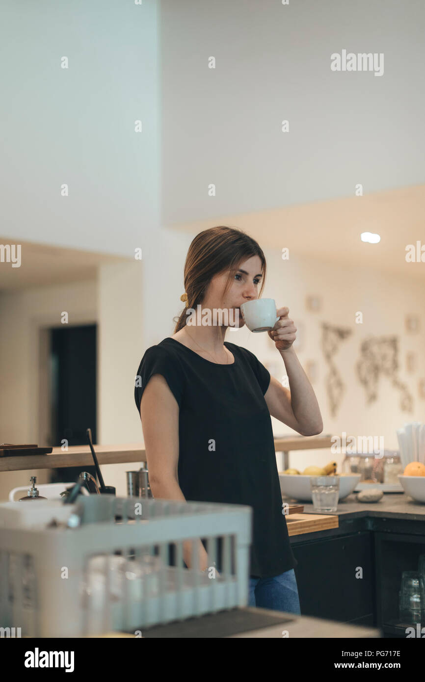 waitress in a coffee bar having a break drinking cup of coffee Stock ...