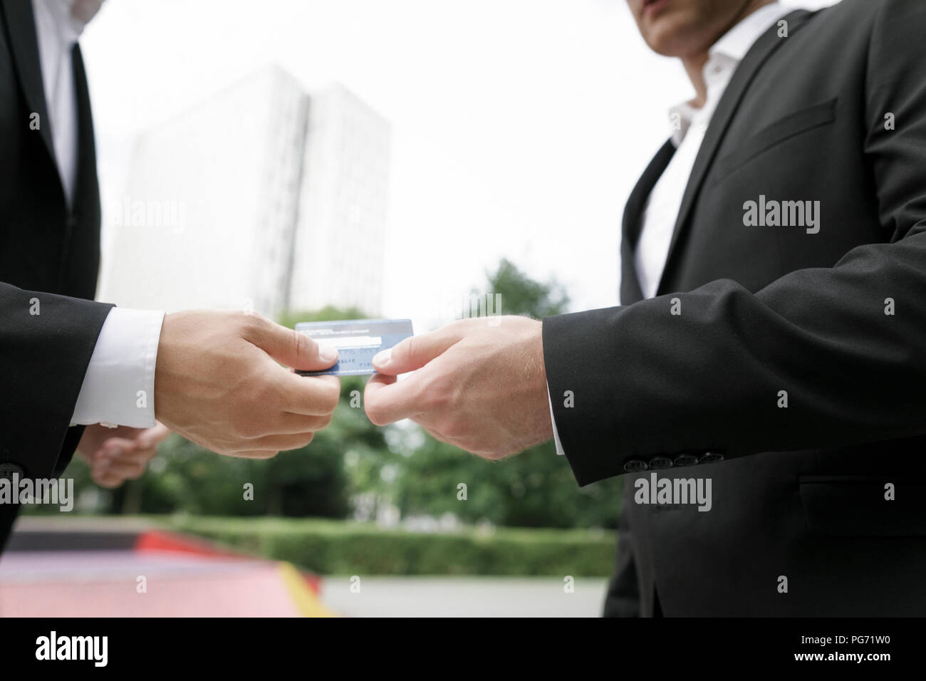 Handing Over Card High Resolution Stock Photography and Images - Alamy