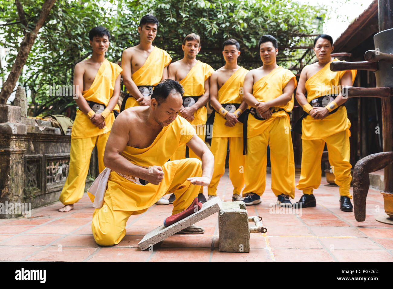 Vietnam, Hanoi, men exercising kung fu, man on flagstone Stock Photo ...