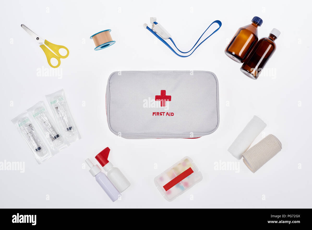 flat lay with automotive first aid kit with various medicines isolated ...