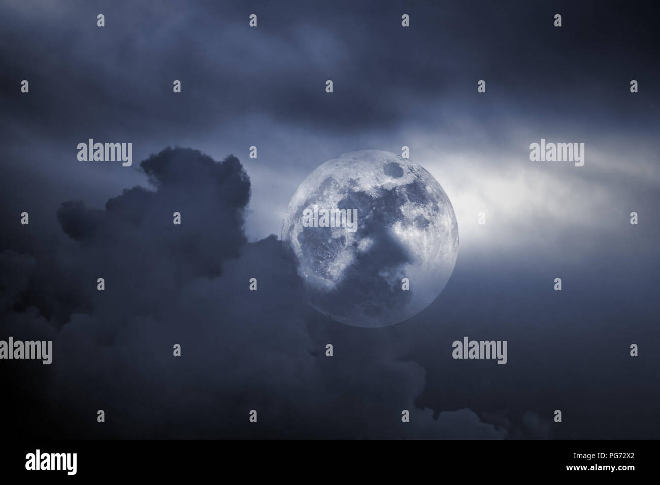 Moon between clouds hi-res stock photography and images - Alamy