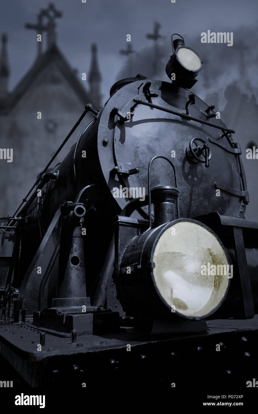 Old dark steam train in a cemetery station. Conceptual image about fear ...