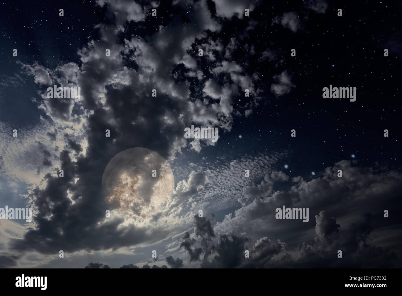 Full moon in a bright cloudy night Stock Photo - Alamy