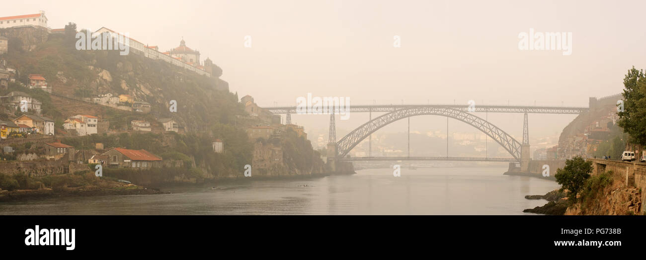 One of the many bridges of Porto, over Douro river; early morning light ...