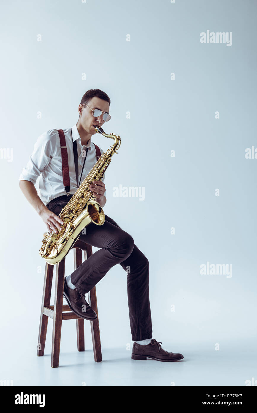 Sitting on play stool hi-res stock photography and images - Alamy