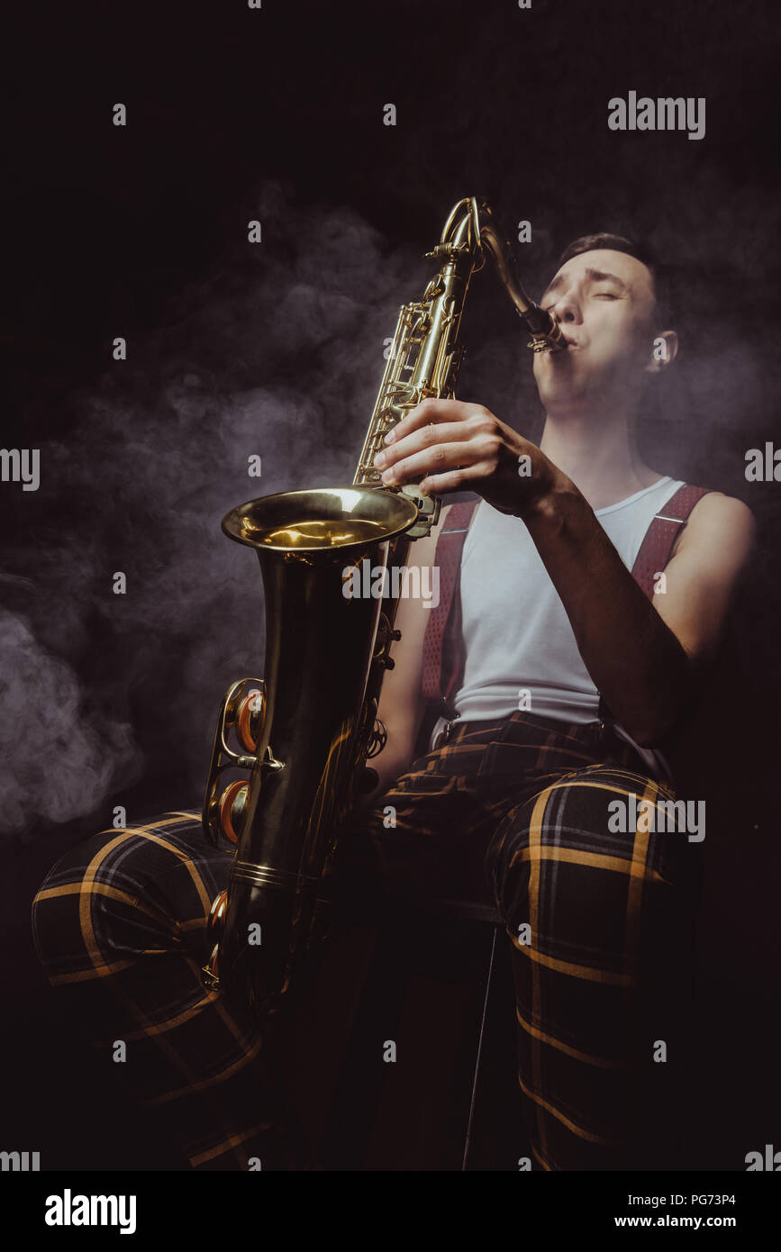Playing saxophone low angle view hi-res stock photography and images ...
