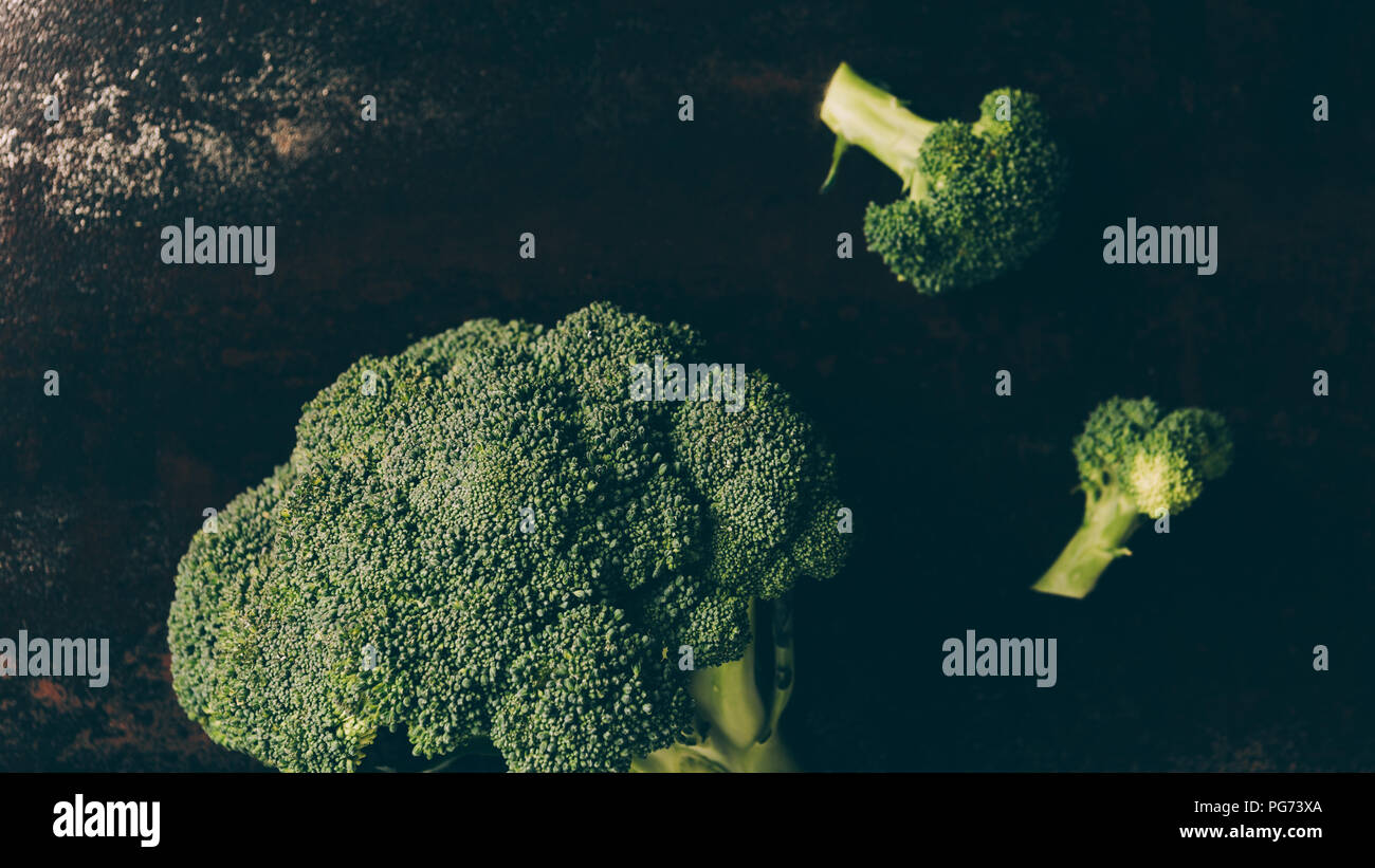 top view of green broccoli on grey dark table Stock Photo - Alamy