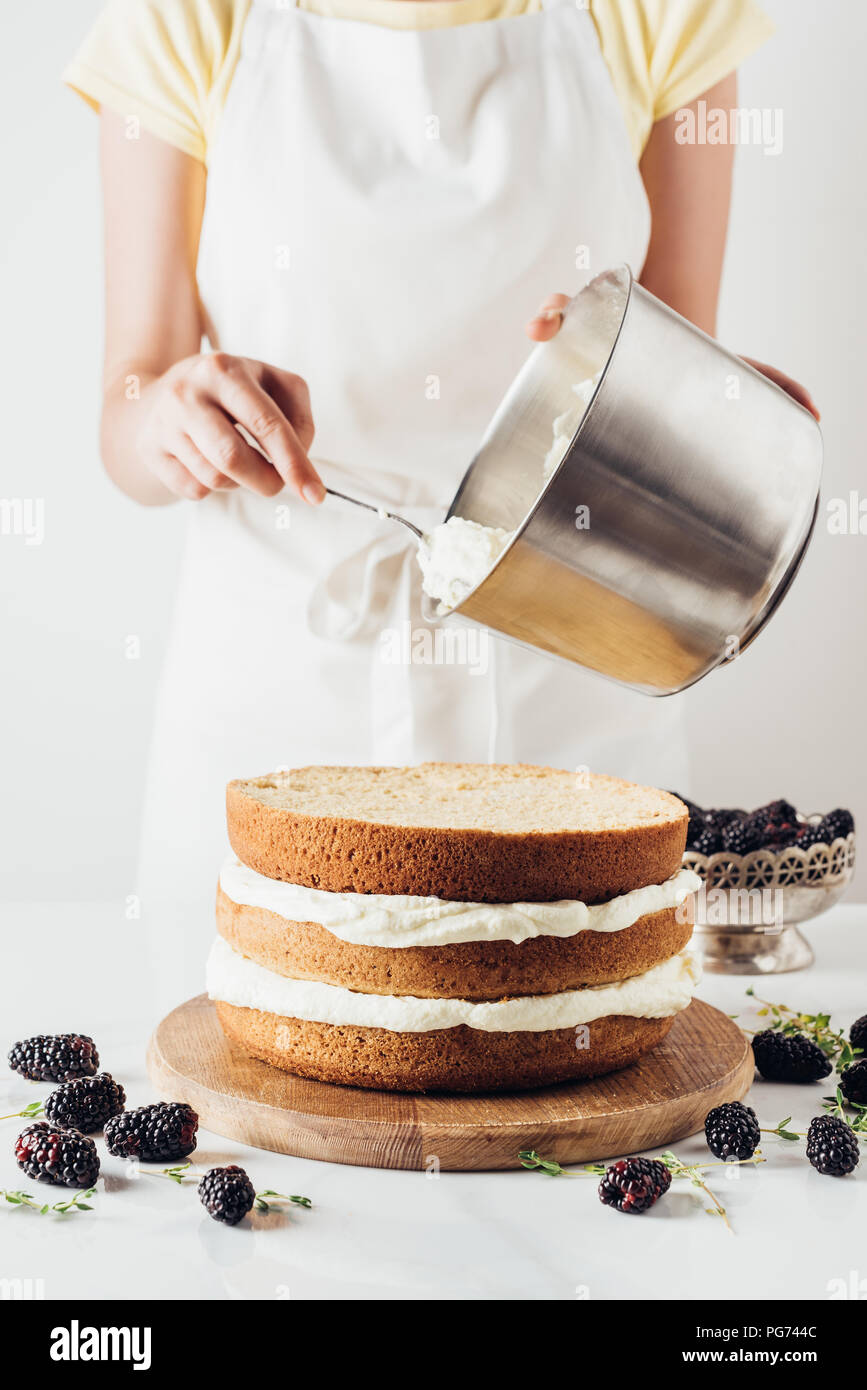 Woman pouring cream onto hi-res stock photography and images - Alamy