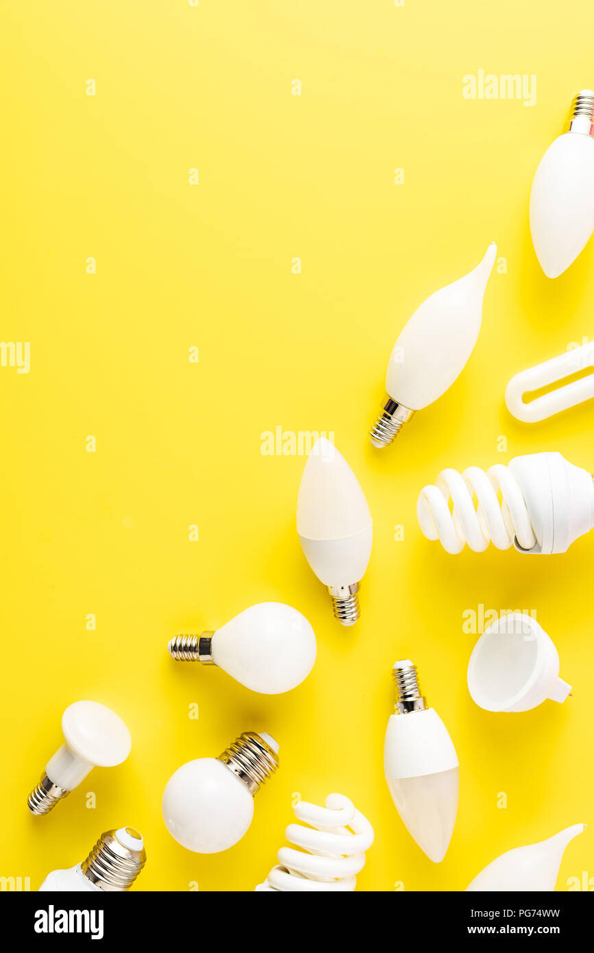 top view of various types of light bulbs on yellow background Stock ...