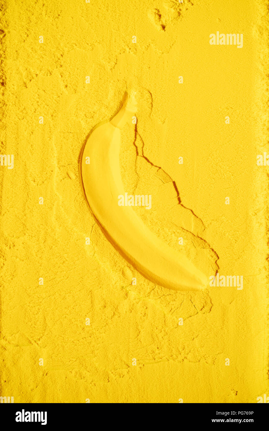 top view of banana shape in bright yellow powder Stock Photo - Alamy