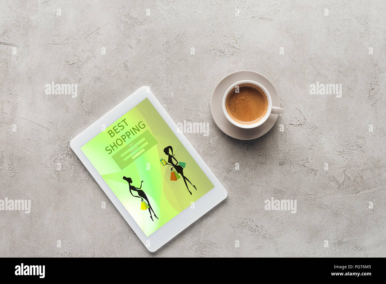top view of cup of coffee and tablet with best shopping app on screen ...