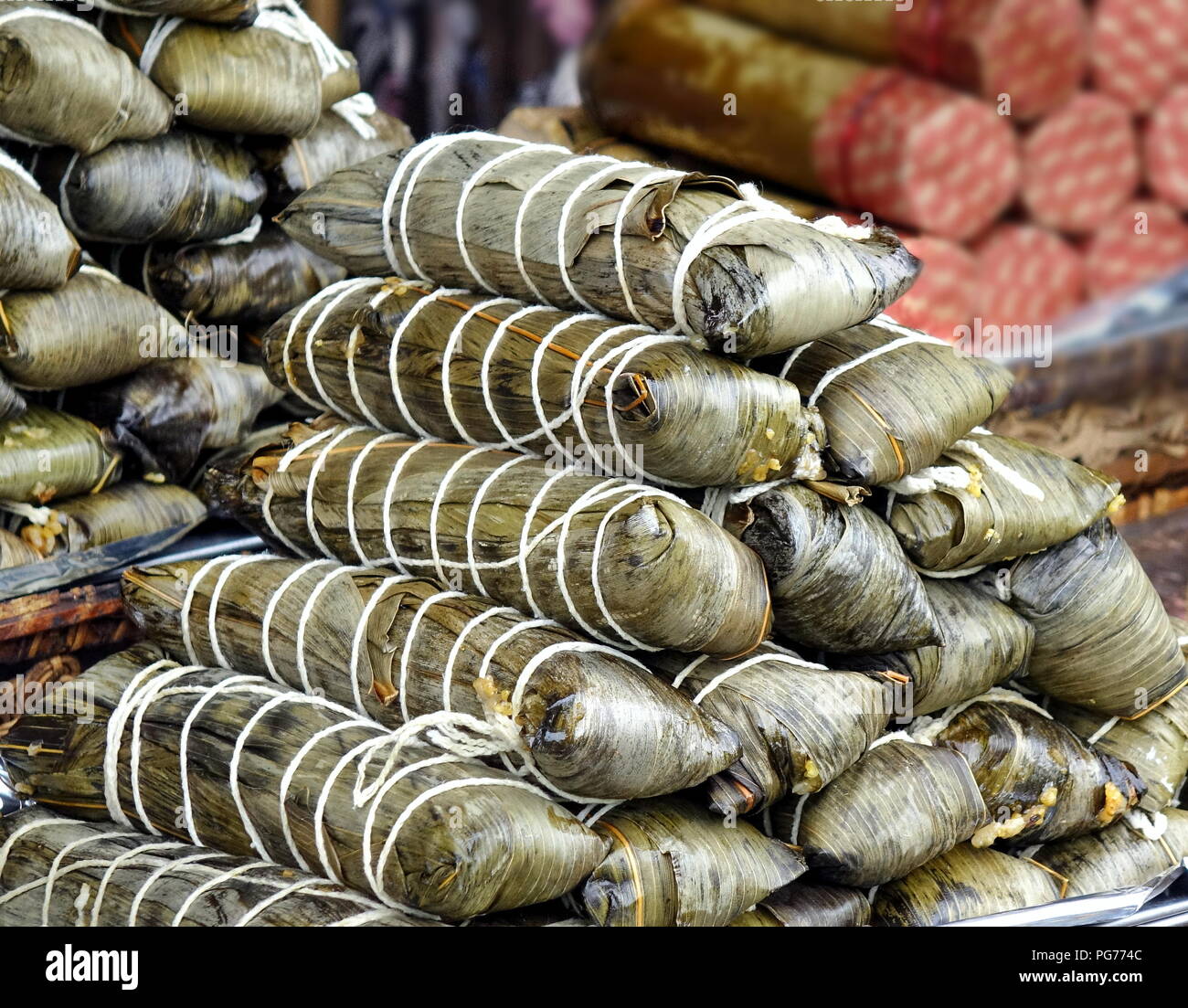 Rice is cooked wrapped in palm leaves, a native Taiwan specialty Stock ...