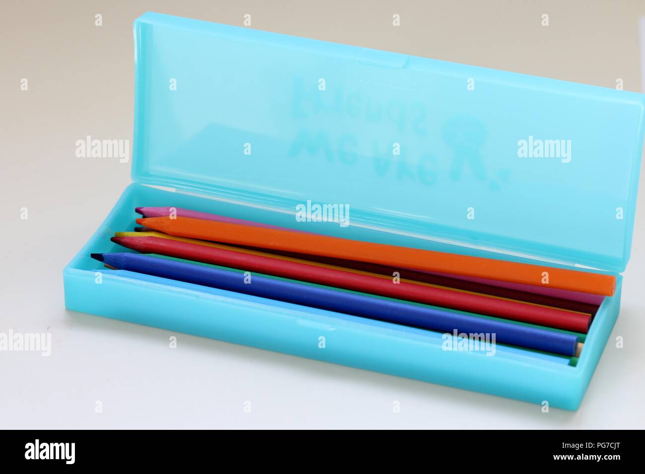 Colored pencils in a light blue pencil case Stock Photo - Alamy